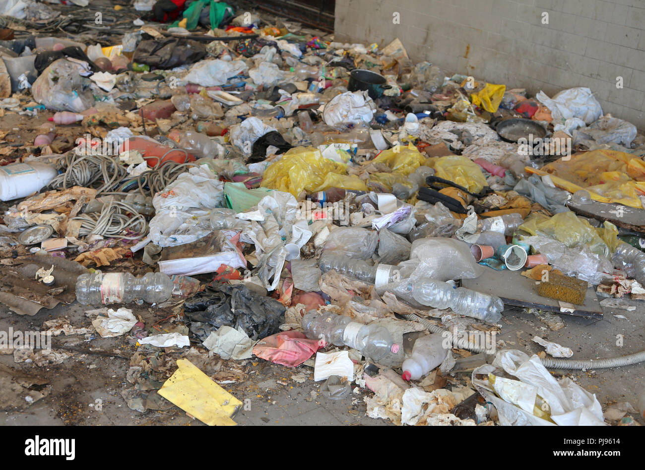 trash bags, plastic bottles and abandoned garbage in an unused and ...