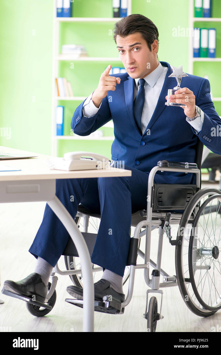 Disabled businessman working in the office Stock Photo - Alamy