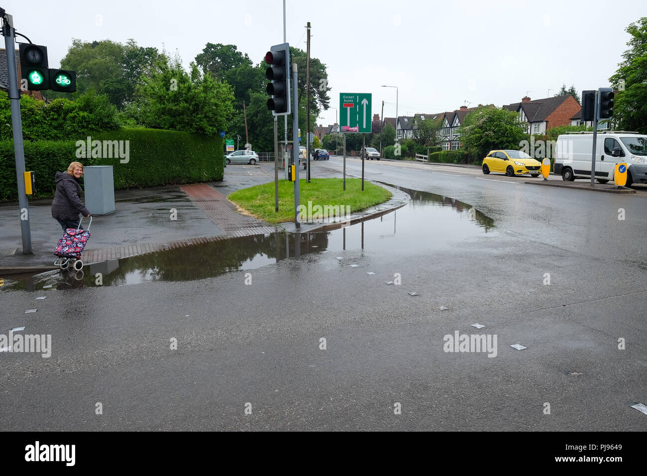 women walking through a large puddle Stock Photo - Alamy