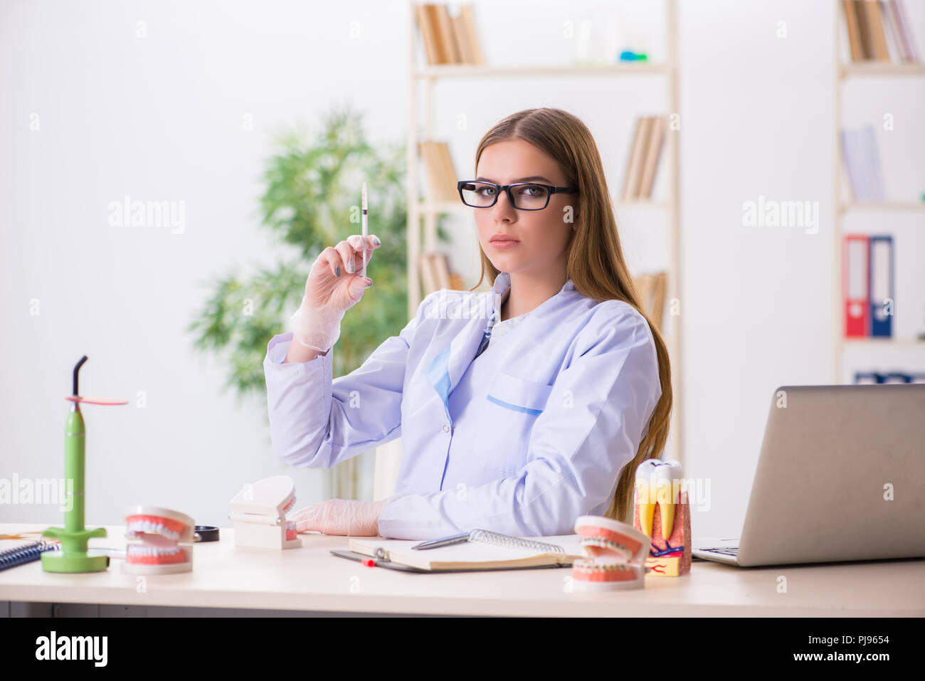 Dentistry student practicing skills in classroom Stock Photo - Alamy
