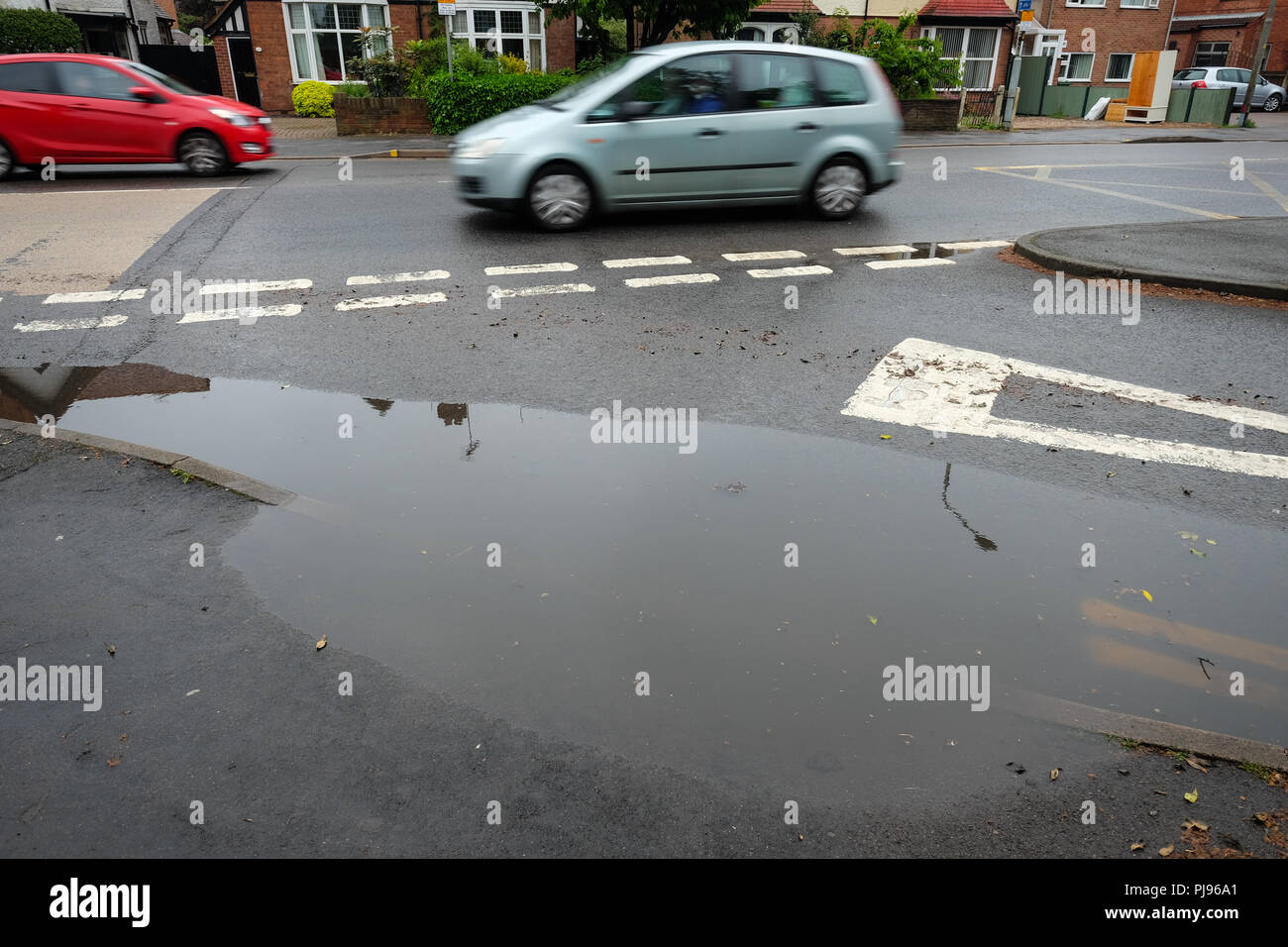 large puddle after heavy rain Stock Photo - Alamy