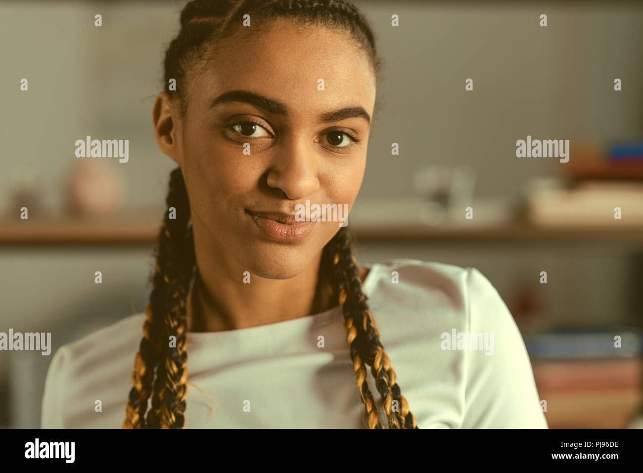 Friendly looking girl smiling into camera Stock Photo - Alamy