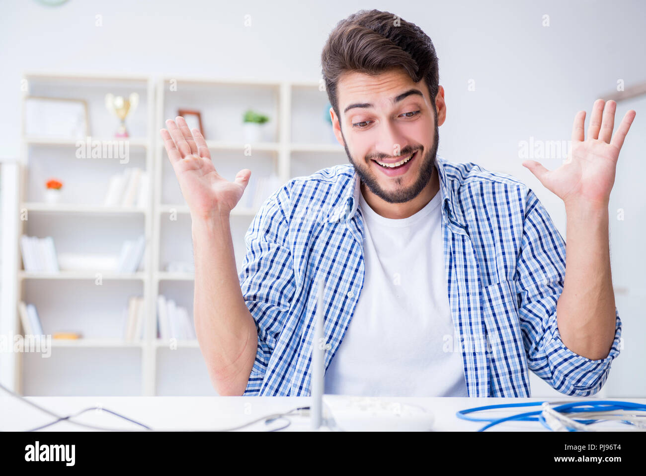 Man enjoying fast internet connection Stock Photo - Alamy