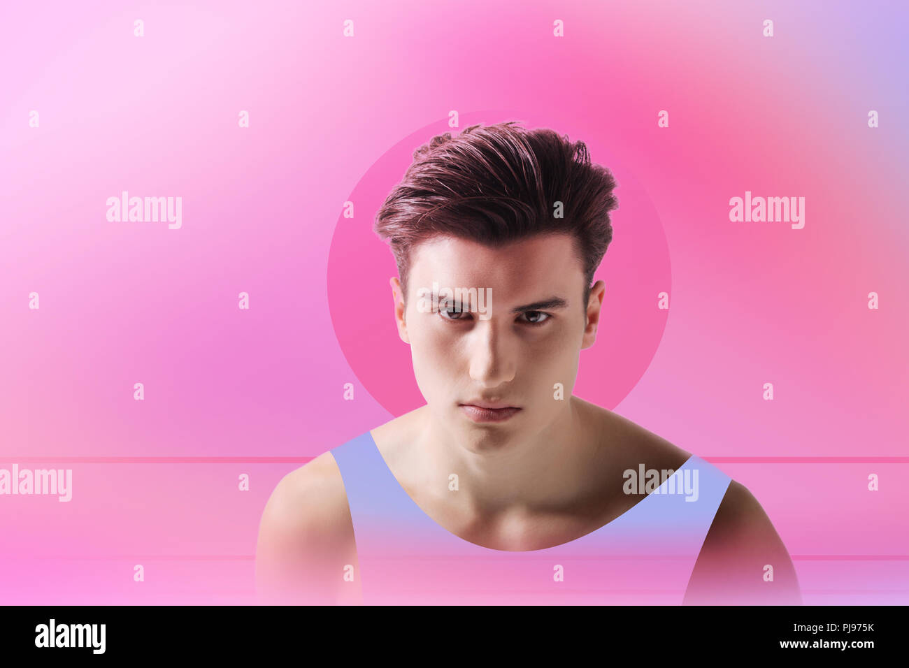 Serious good looking man standing against pink background Stock Photo ...