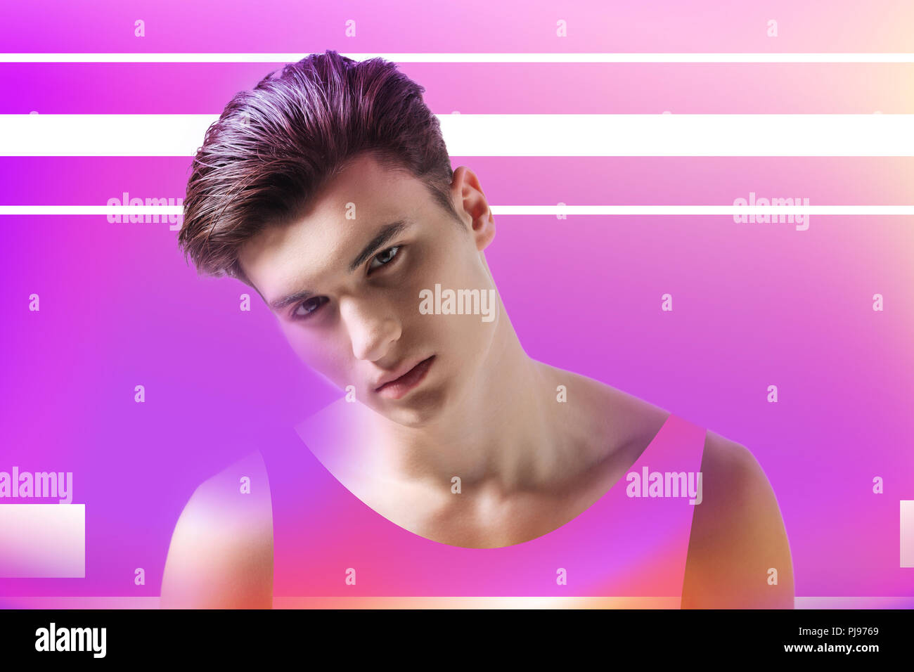 Attractive brunette man leaning his head to the right Stock Photo - Alamy