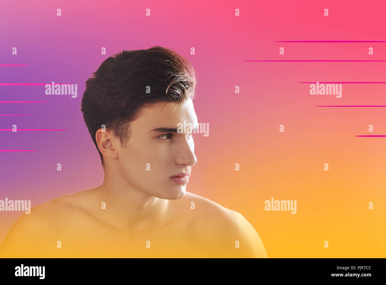 Pleasant handsome young man standing half face Stock Photo - Alamy