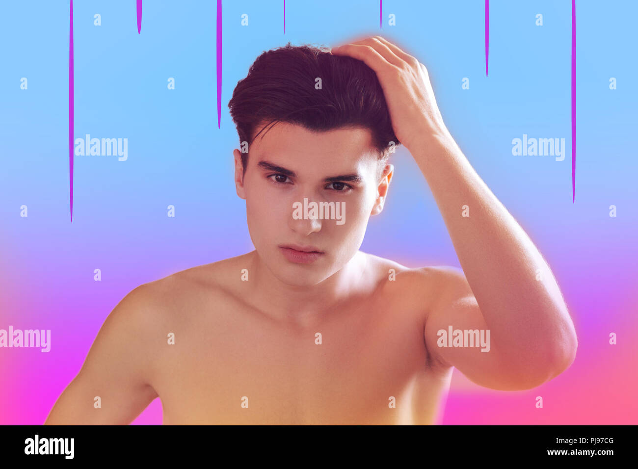 Nice handsome man holding his hand up Stock Photo - Alamy