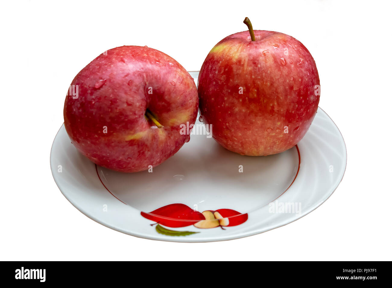 Red apple on plate. Isolated on white background Stock Photo - Alamy