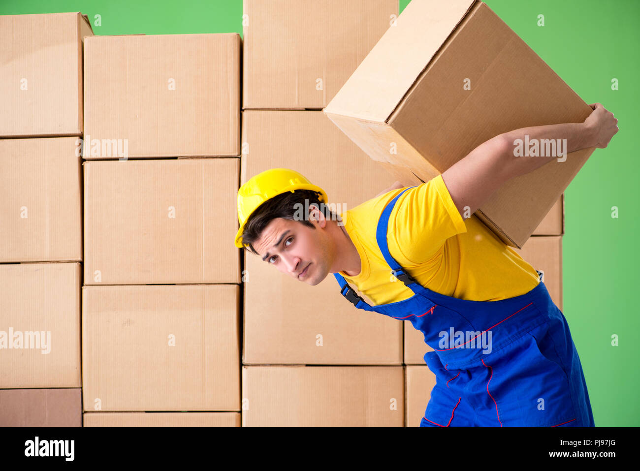 Man contractor working with boxes delivery Stock Photo - Alamy