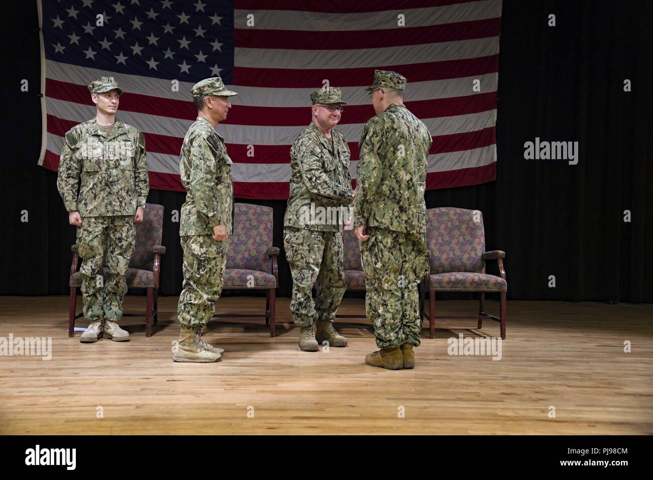 MANAMA, Bahrain (July 08, 2018) Rear Adm. James E. Pitts, center ...