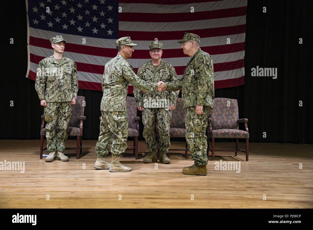 MANAMA, Bahrain (July 08, 2018) Rear Adm. James E. Pitts, center ...