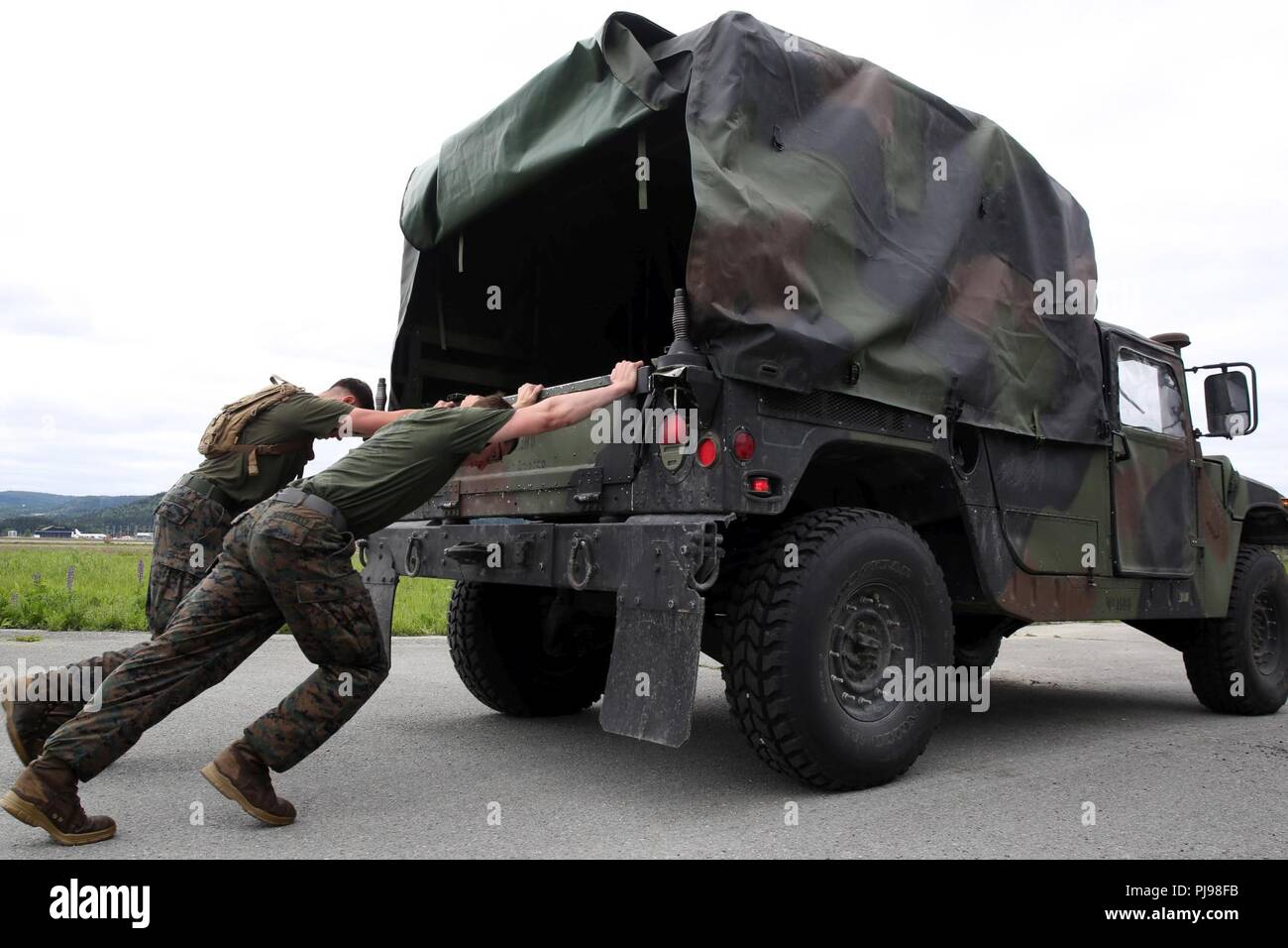U.S. Marines with Marine Rotational Force-Europe 18.1 push a military ...