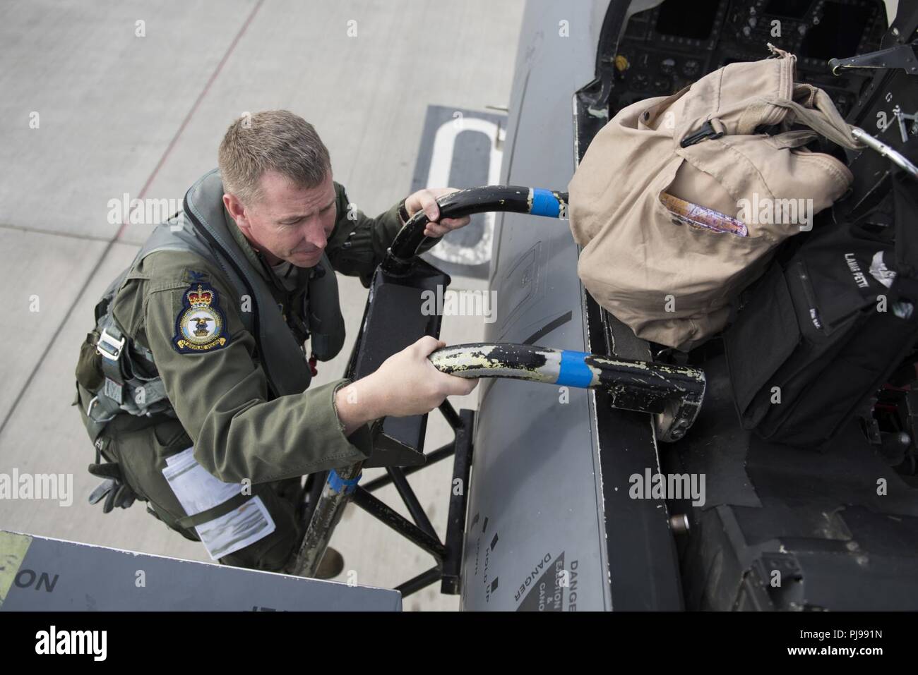 U.S. Air Force Col. Evan Pettus, 48th Fighter Wing commander, climbs ...