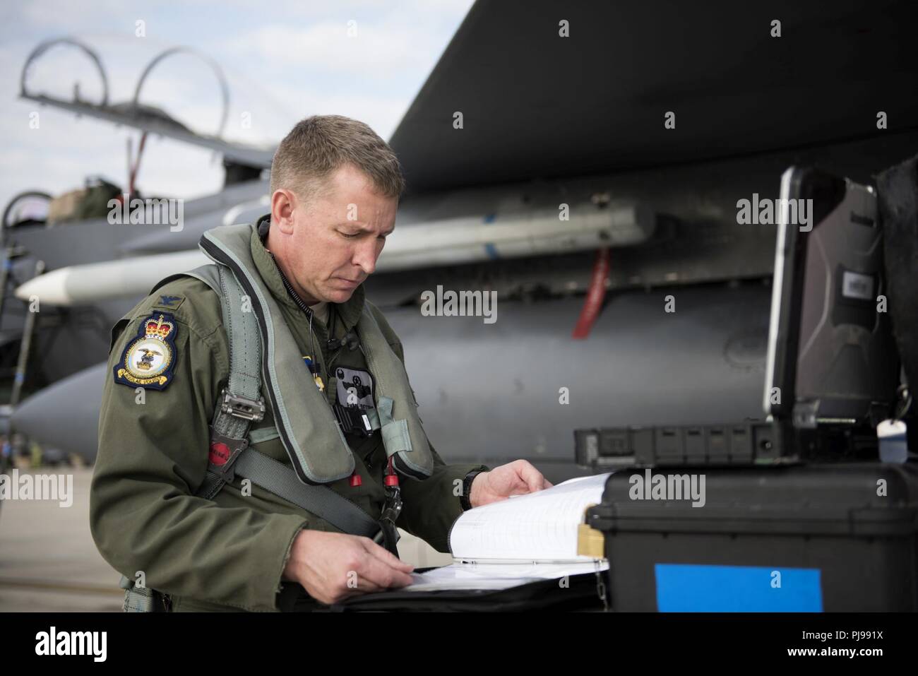 U.S. Air Force Col. Evan Pettus, 48th Fighter Wing commander, reviews ...