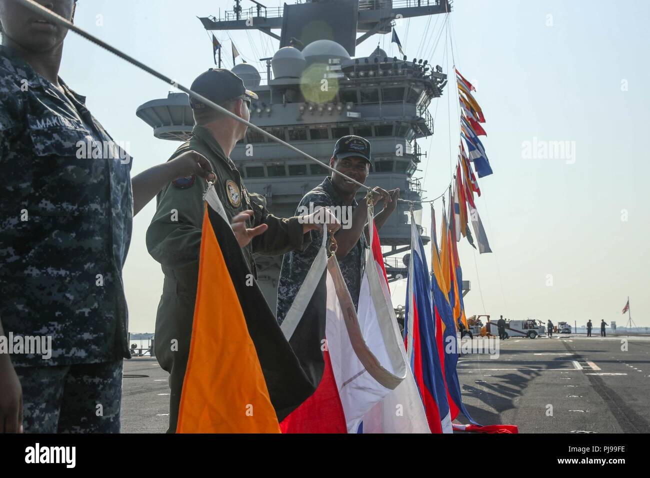 (July 3, 2018) Sailors dress the ship with holiday flags and penants ...