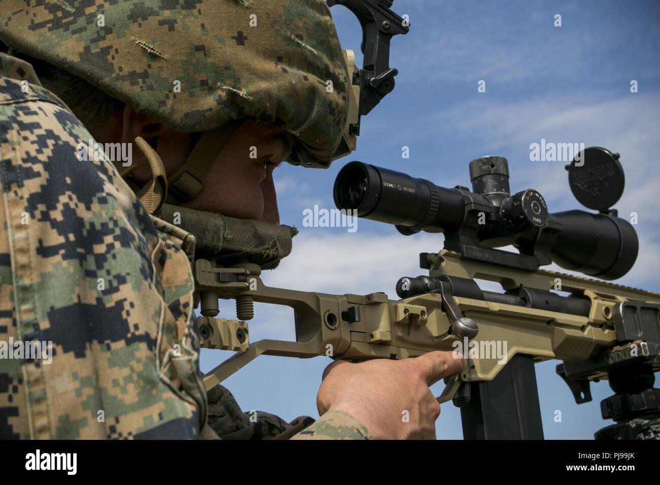 A U.S. Marine with Black Sea Rotational Force 18.1 sights in on a ...