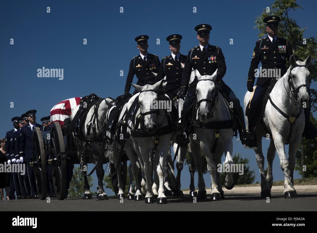 A horse-led caisson escorts the casket of Capt. Mark Weber during his ...