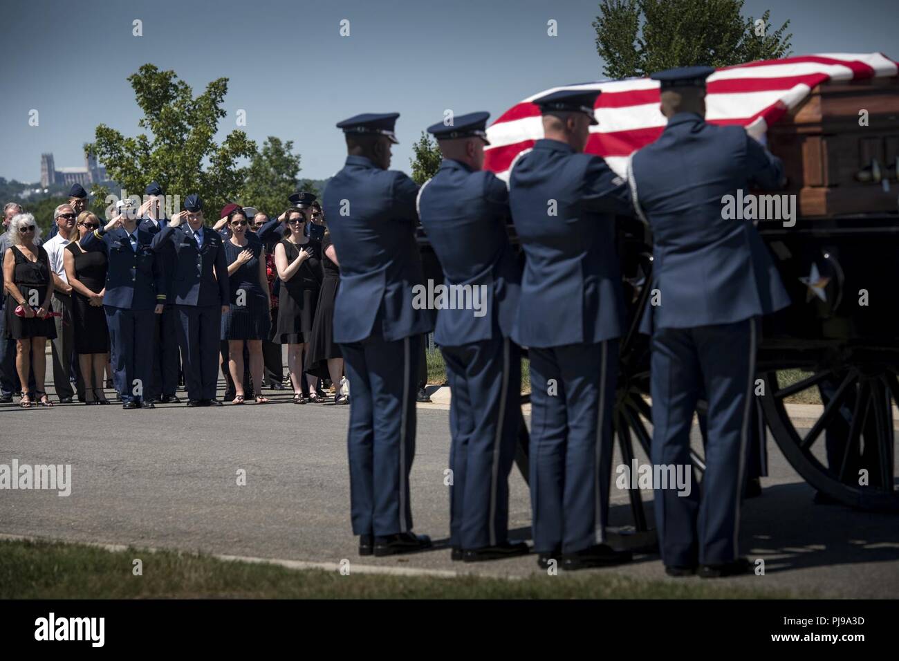 Friends and family of Capt. Mark Weber watch as his casket is ...