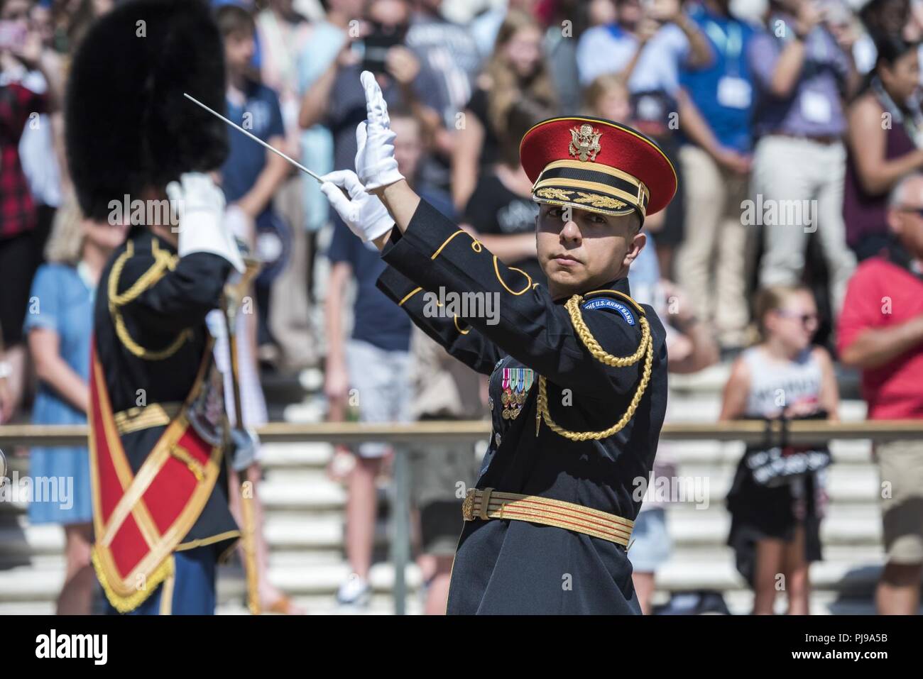 A conductor from The U.S. Army Band, “Pershing’s Own” supports an Army ...