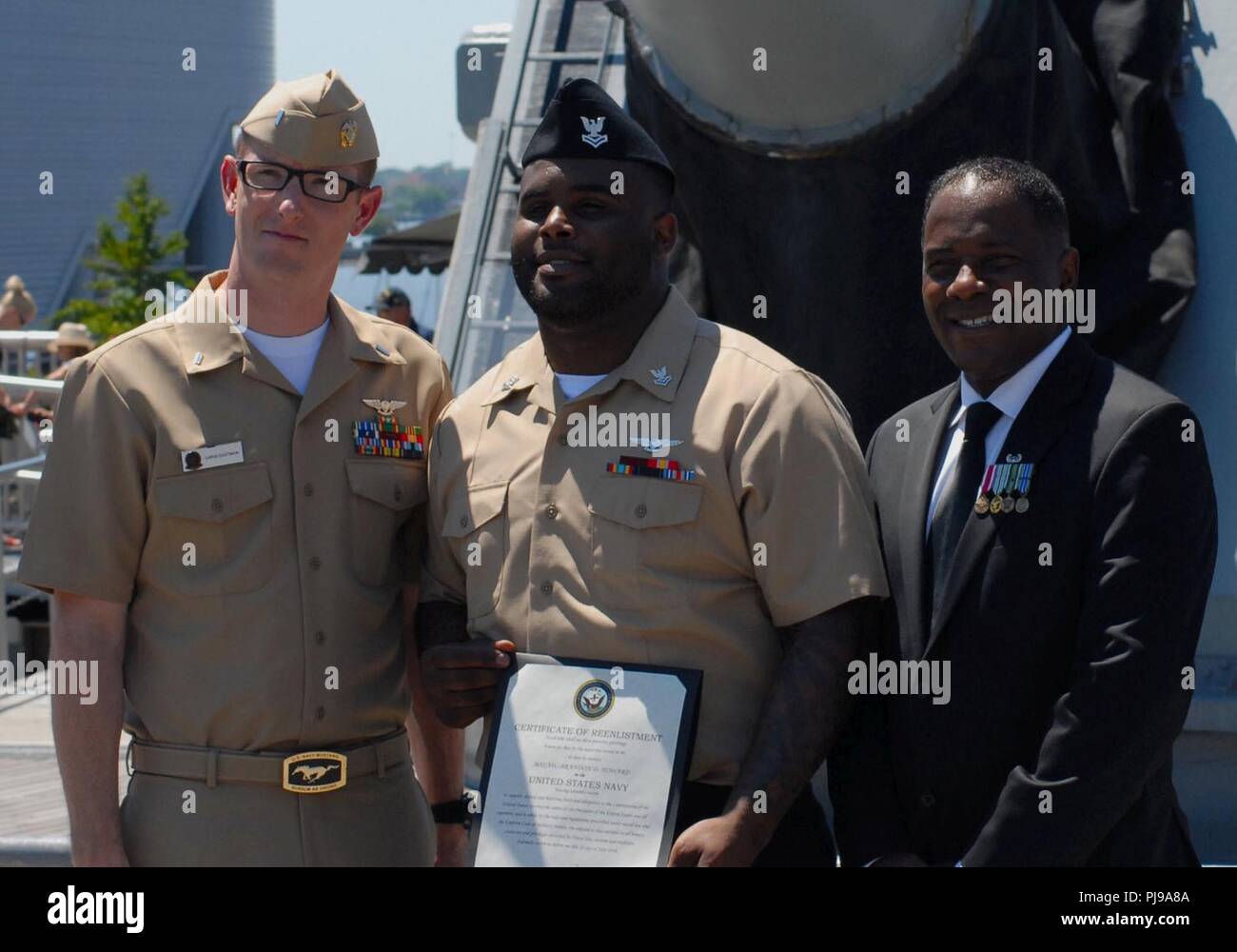 Lt(JG) Christopher Eastman (left) stands next to AO2(AW) Brandon Howard ...