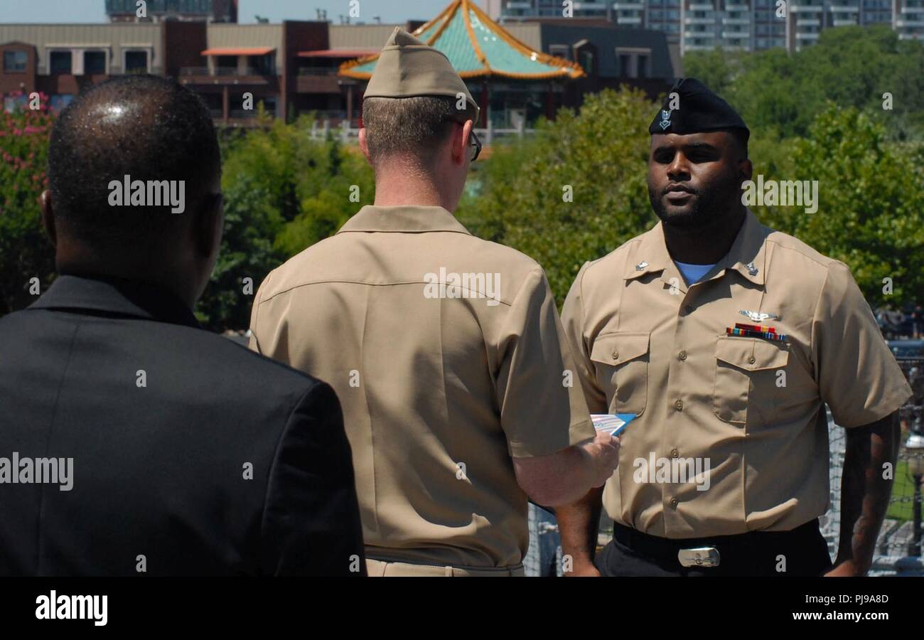 AO2(AW) Brandon Howard stands at attention as he is honorably ...