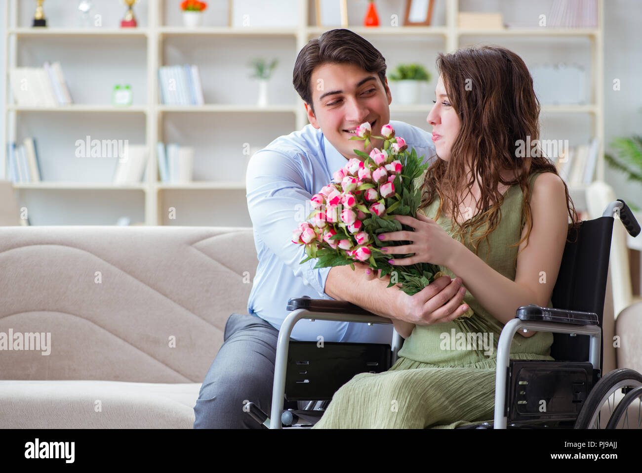 Man making marriage proposal to disabled woman on wheelchair Stock ...