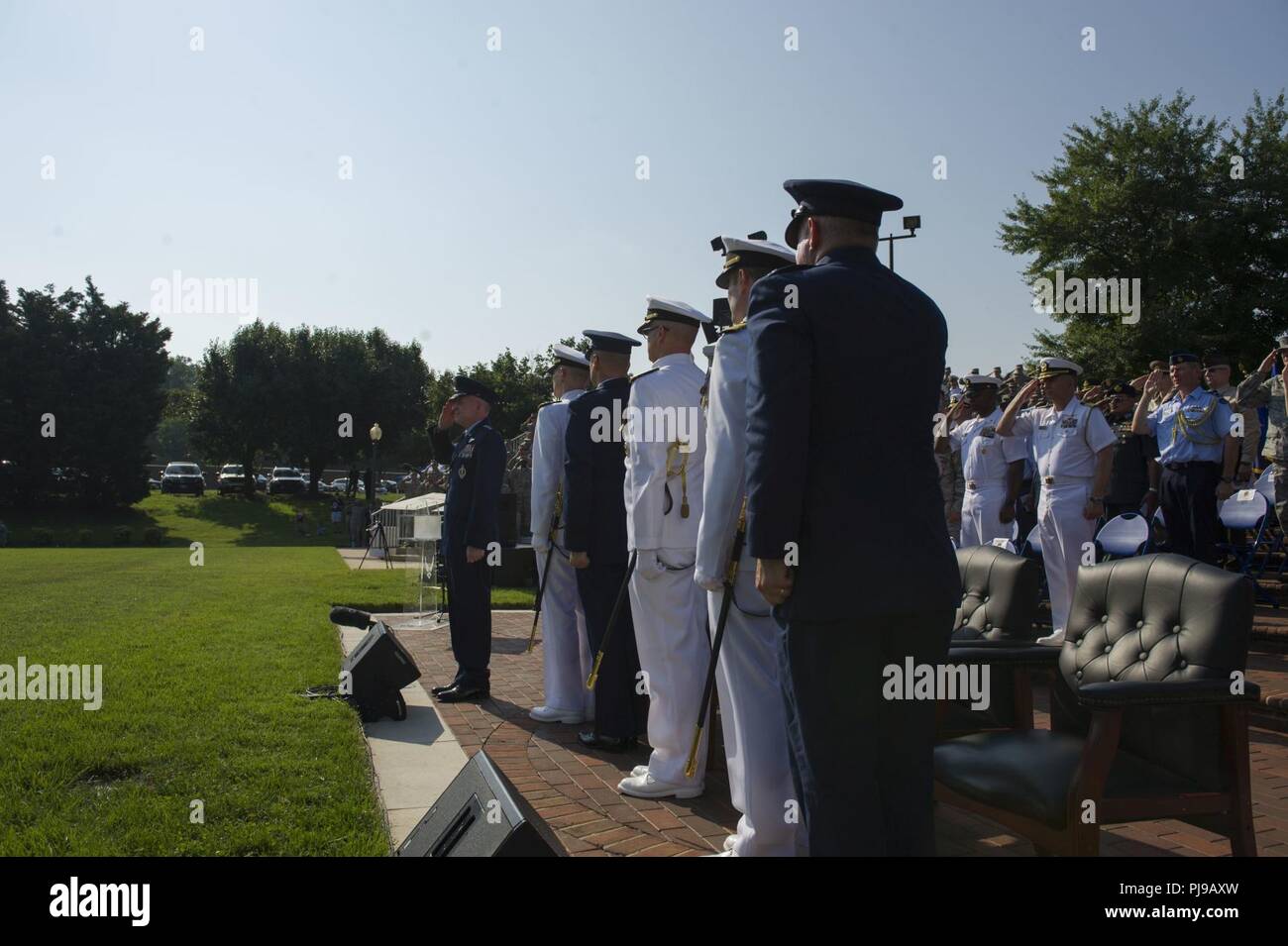 Members of the official party render honors to the host, Gen. Stephen W ...