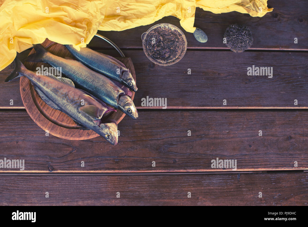 Fresh catch fish rasp three pieces on wooden table. Food ingredient ...