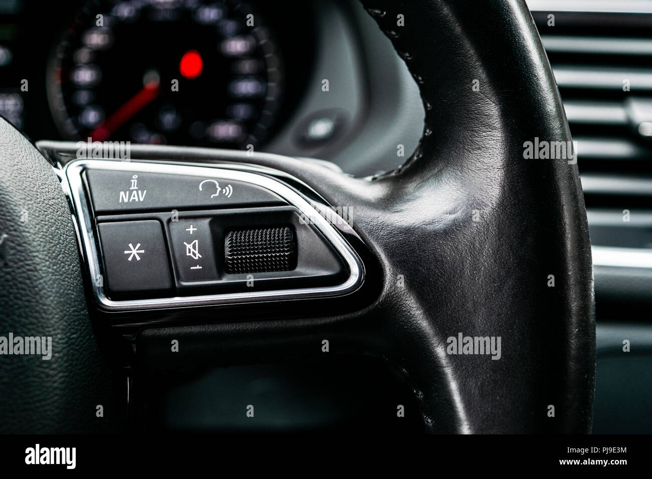 Modern car interior. Steering wheel with media phone control buttons ...
