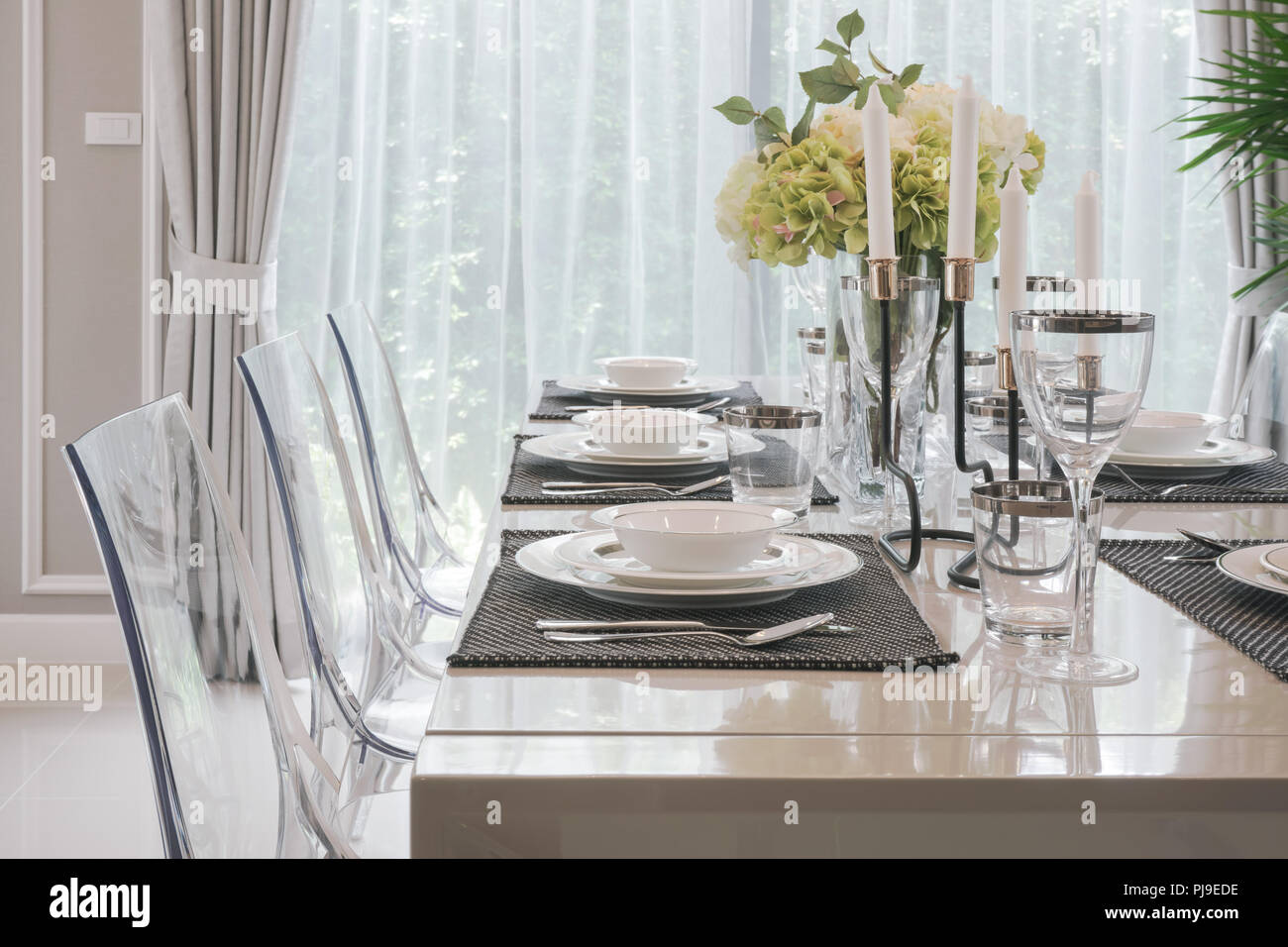 Modern classic style tableware on dining table with flower jar Stock ...