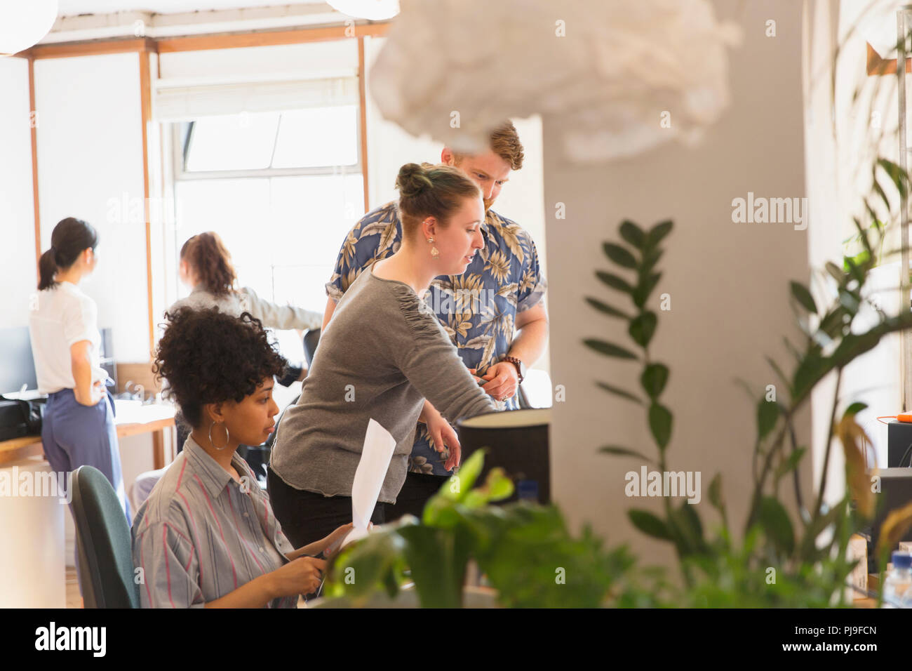 Creative business people working in office Stock Photo - Alamy