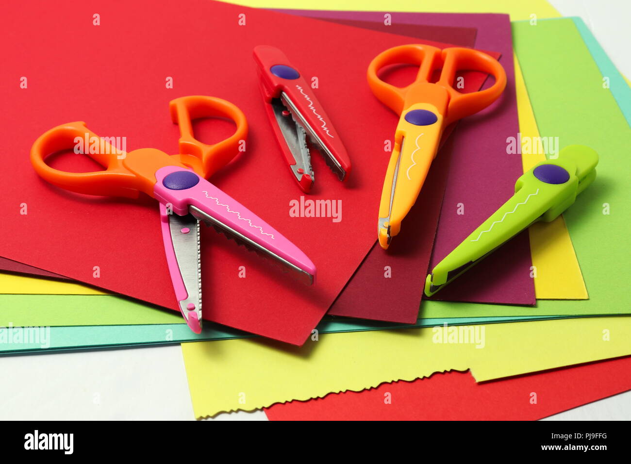 Decorative scissors and colorful cartons for crafts Stock Photo - Alamy