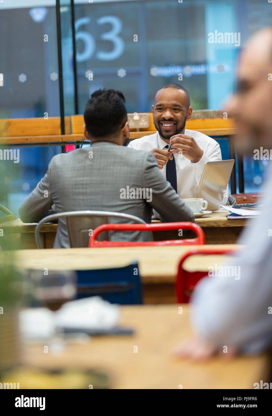 Young businessmen working in meeting hi-res stock photography and ...