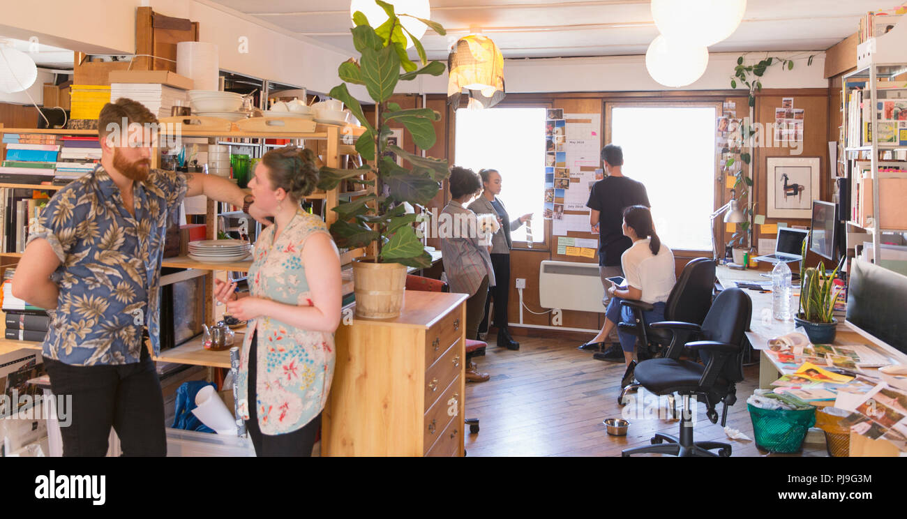 Creative business people talking, working in office Stock Photo - Alamy