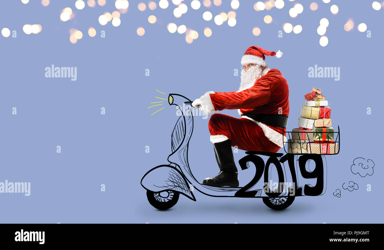 Santa Claus on scooter Stock Photo - Alamy