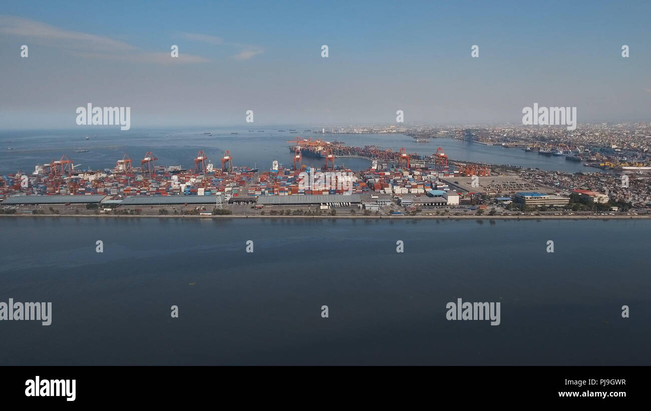 Aerial view industrial cargo port with ships and cranes, Manila. View ...