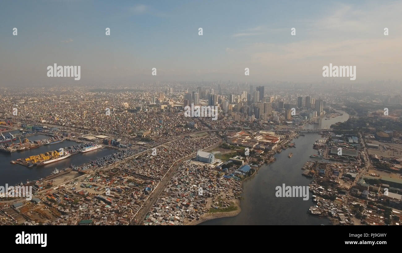 Aerial view skyline of Manila city. Fly over city with skyscrapers and ...
