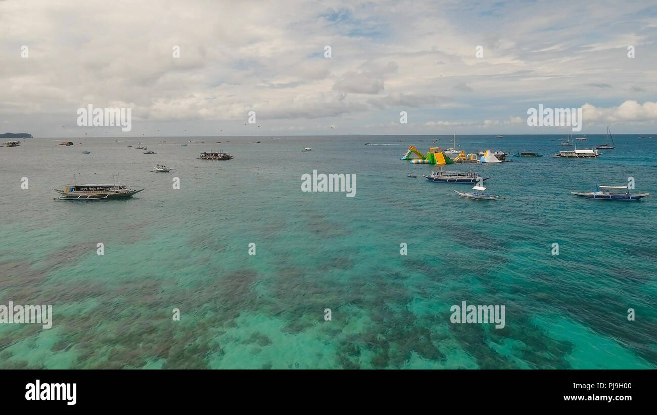 Summer sport, parasailing and boat, Boracay. Water sports and ...