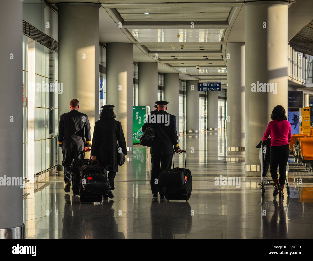 Cabin crew walking hi-res stock photography and images - Alamy