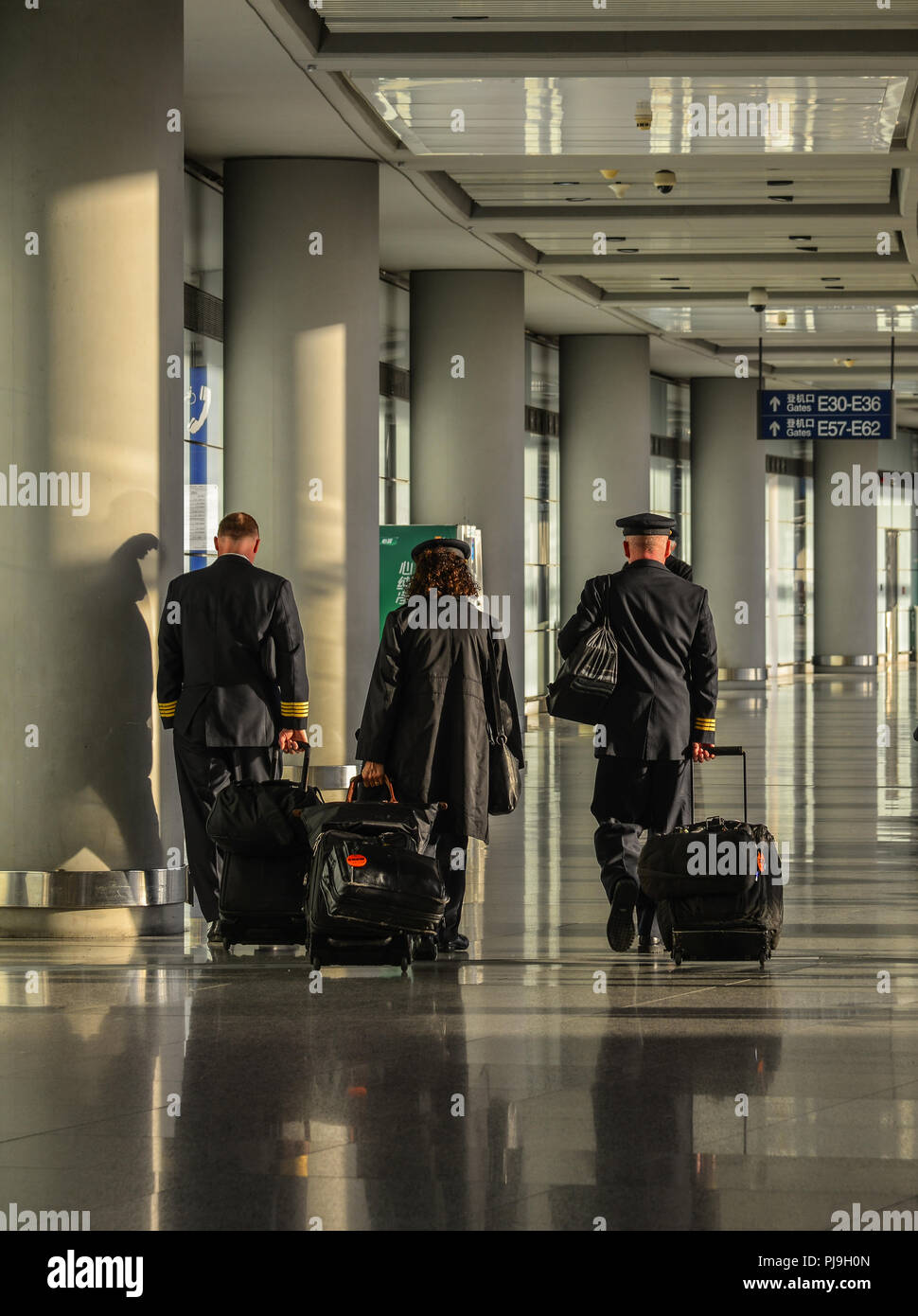 Beijing, China - Feb 28, 2018. Cabin crew walking at Beijing Capital ...