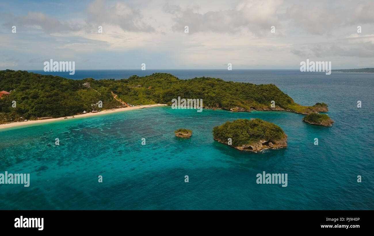 Aerial view of beautiful tropical island with white sand beach, hotels ...