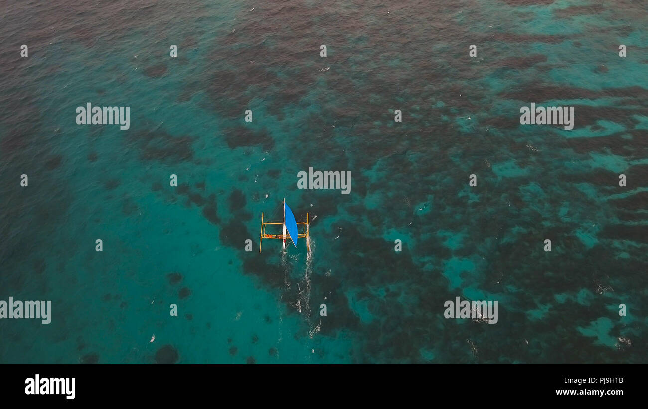 Sailing boat in blue, turquoise lagoon. Sailing ship yachts with blue ...
