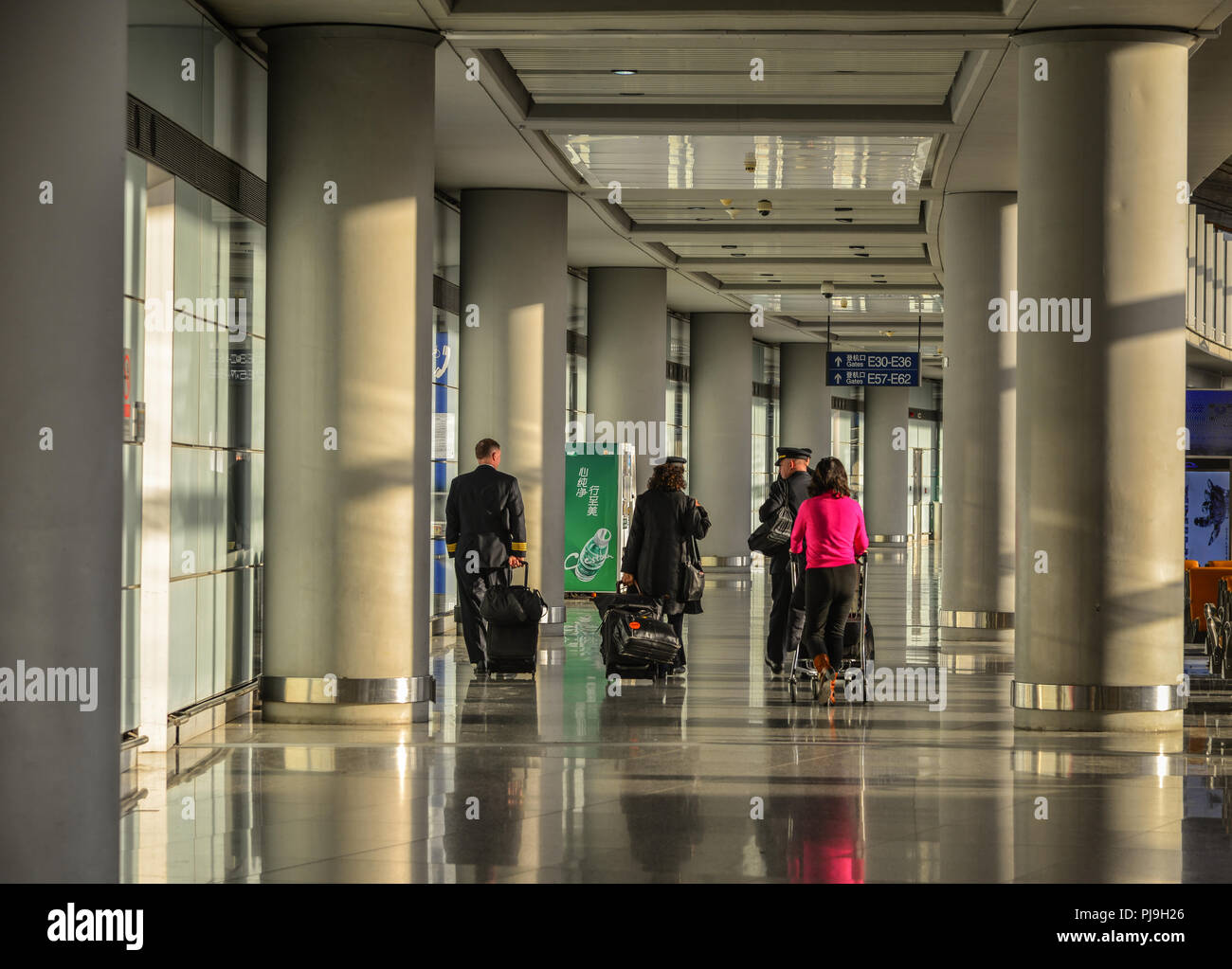 Beijing, China - Feb 28, 2018. Cabin crew walking at Beijing Capital ...
