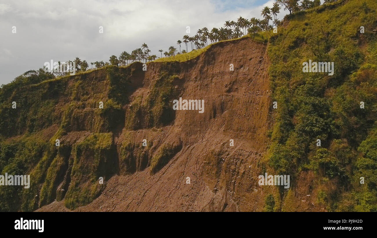 Landslides and rockfalls on the road in the mountains, Camiguin. Aerial ...
