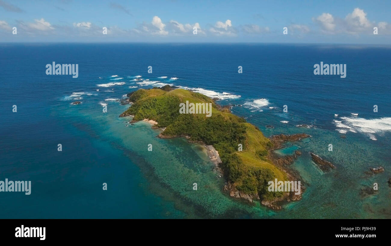 Aerial view:Tropical island with beach, mountains and the rainforest ...