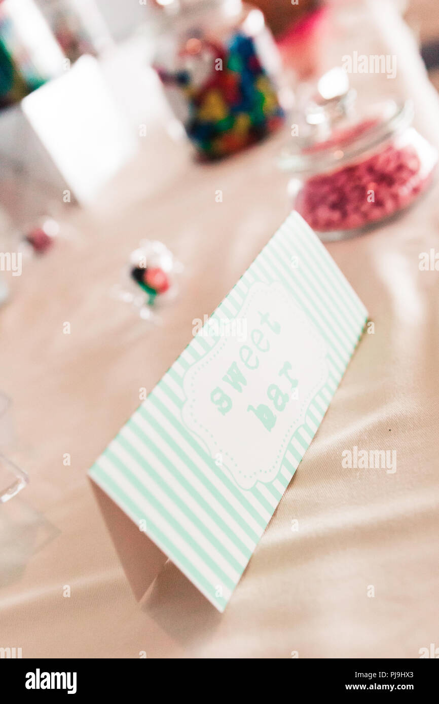 Sweet Bar Paper Sign on Wedding Table with Coloured Sweets Stock Photo ...