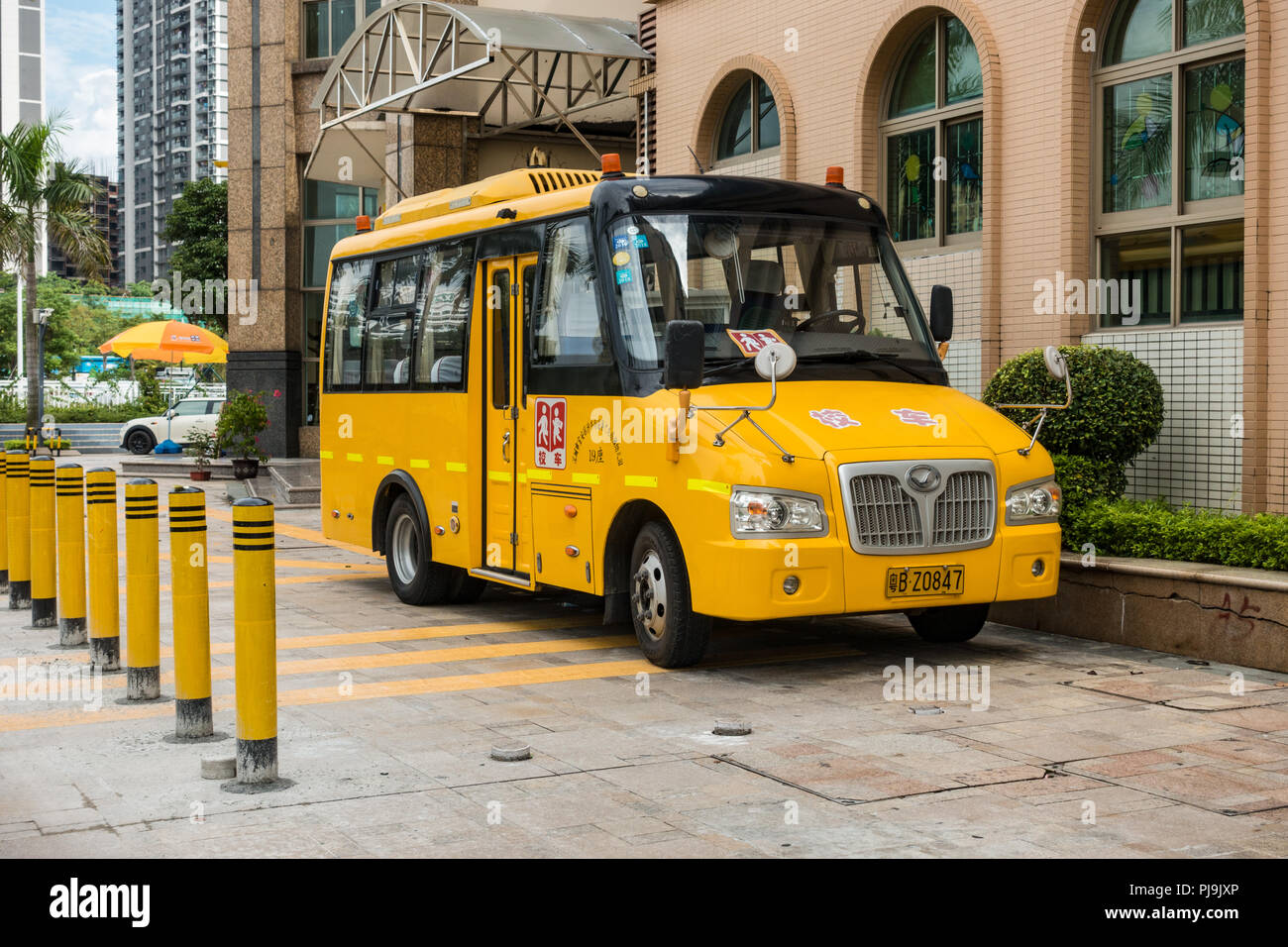 Chinese school bus parked in front of Chinese kindergarten in Shenzhen ...