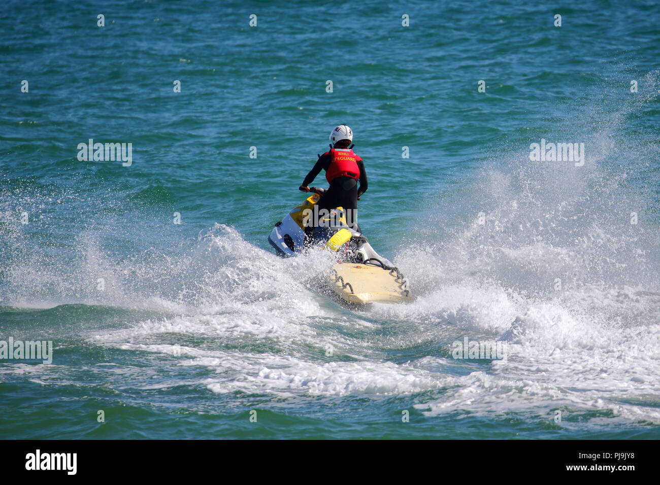 Lifeguard riding a jet ski hi-res stock photography and images - Alamy