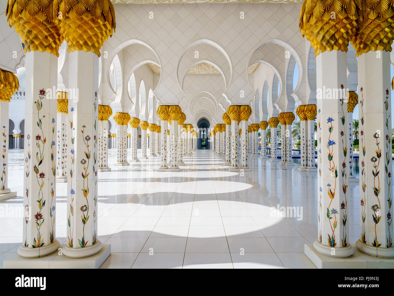 A colonnade in Sheikh Zayed Grand Mosque in Abu Dhabi, UAE Stock Photo ...
