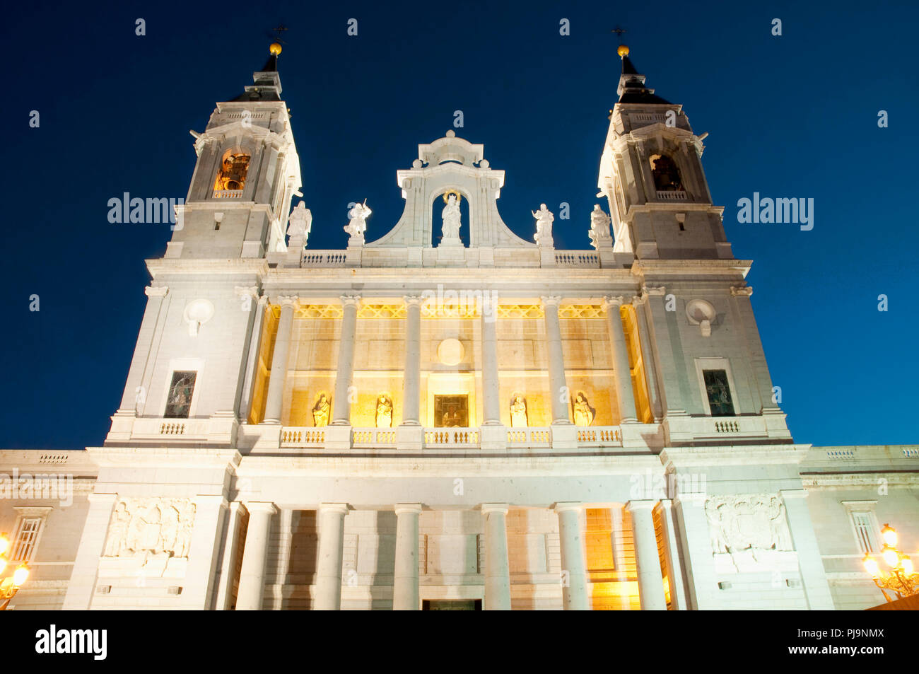 Main facade of the Almudena cathedral, night view. Madrid, Spain Stock ...
